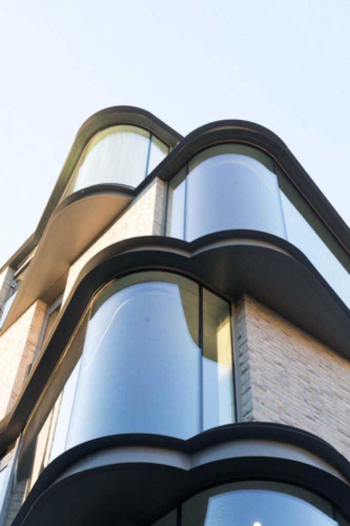 A unique take on the bow window defines this high-end multi-res ...