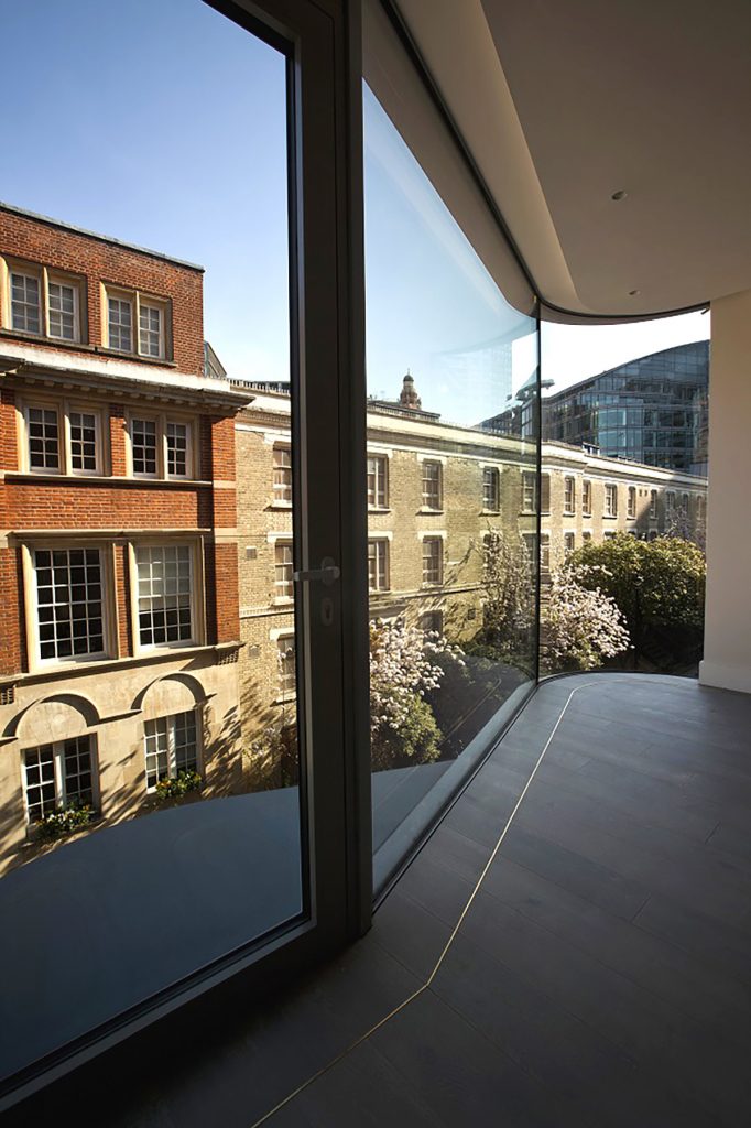A unique take on the bow window defines this high-end multi-res ...
